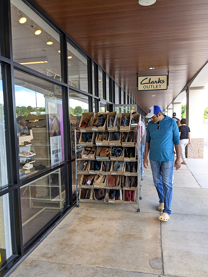 Outside Clarks, a shopper contemplates which comfortable footwear will accompany him on his next adventure. Life's too short for painful shoes.