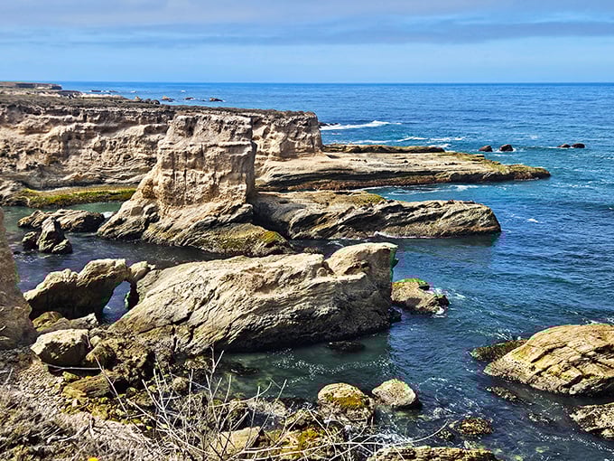 Where ancient rock formations meet the Pacific in a dance older than memory itself.