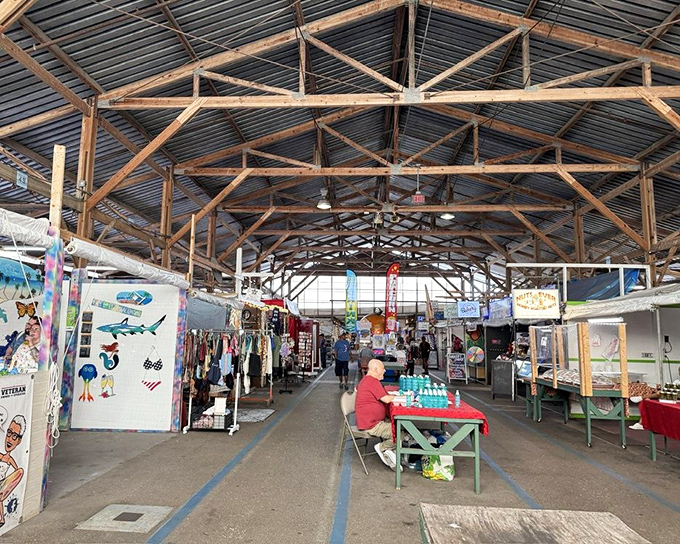 Rustic wooden beams frame this shopper's paradise, where one person's browsing becomes another's serendipitous discovery.