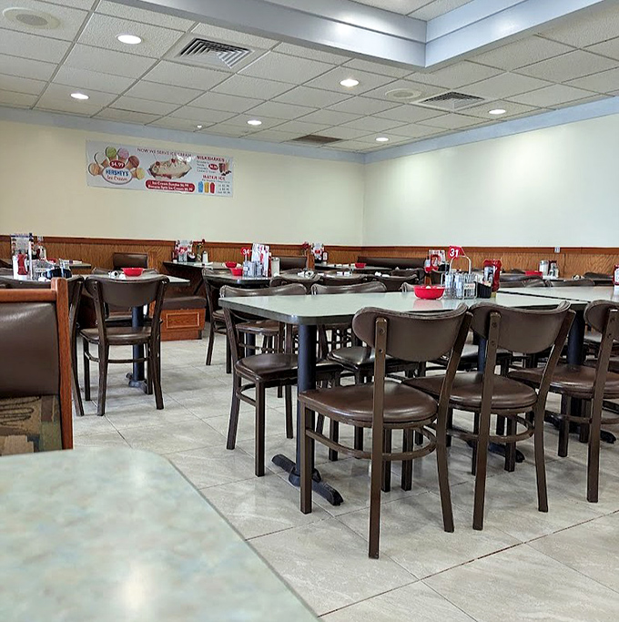 Inside, wood paneling and comfortable seating create that perfect diner atmosphere where conversations flow as freely as the coffee.