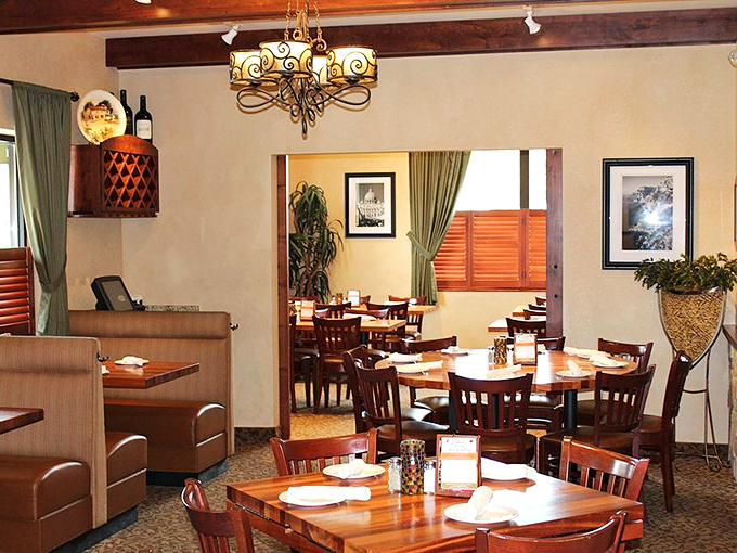 Warm wooden tables, elegant chandeliers, and that inviting glow &ndash; the dining room practically whispers, "Stay awhile and mangia!"