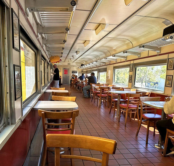 Inside this retired Pacific Railroad car, nostalgia rides alongside hunger as diners enjoy their meals in a space that's equal parts transport history and comfort food sanctuary.