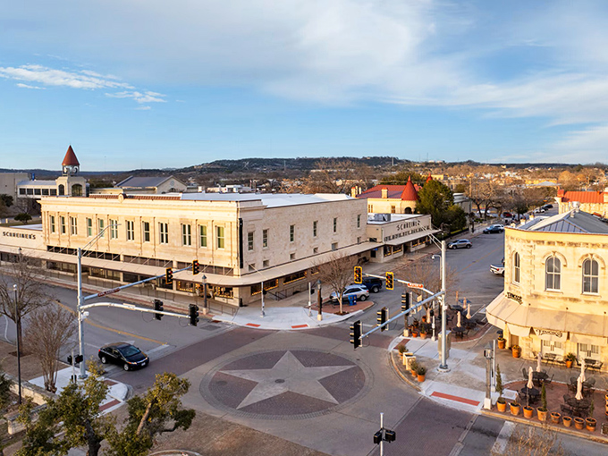 Kerrville's downtown square features a distinctive star design in the pavement, surrounded by well-preserved historic buildings that house local businesses.