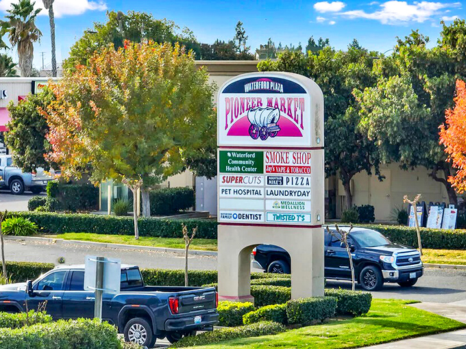 The Pioneer Market sign stands as both town landmark and practical directory &ndash; small-town efficiency at its most charming.