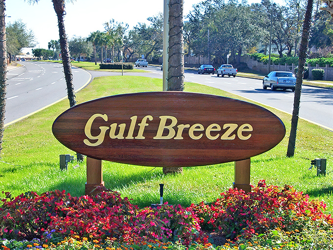 The iconic Gulf Breeze welcome sign, where palm trees stand guard like friendly sentinels. First impressions matter, and this town knows how to make a good one.