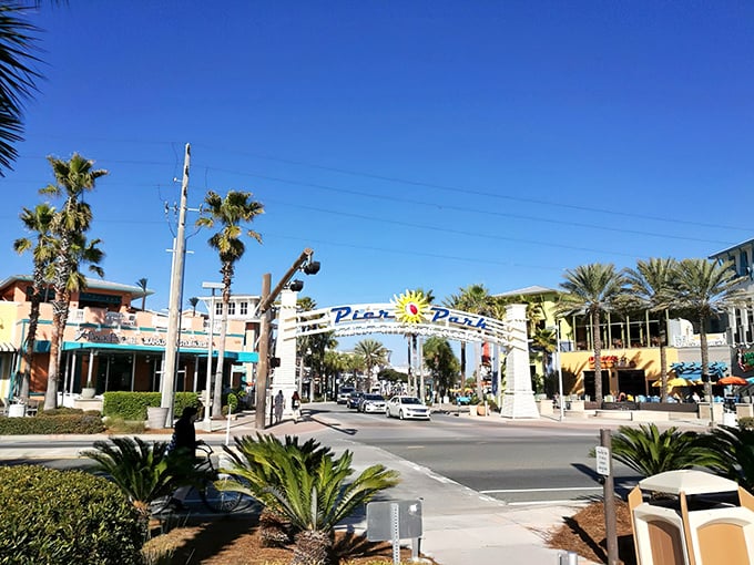 The iconic Pier Park entrance welcomes visitors with palm trees standing at attention like nature's own welcoming committee.