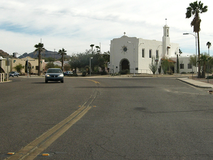 Ajo's plaza unfolds like a perfectly composed postcard&mdash;palm trees, Spanish Colonial architecture, and mountains that look painted by a particularly ambitious Bob Ross.