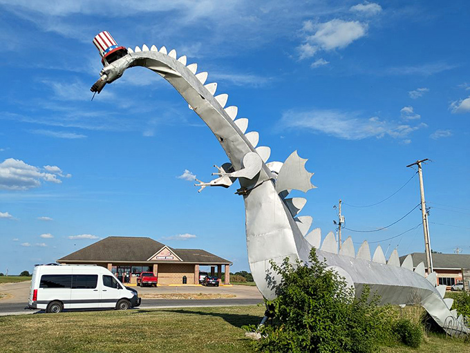 Rural America meets fantasy as the silver dragon towers over the landscape, complete with patriotic headwear and impressive wingspan.