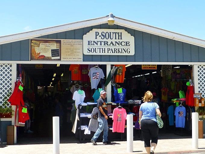 The P-South entrance beckons bargain hunters with colorful t-shirts and the promise of air-conditioned retail therapy on sweltering Florida days.