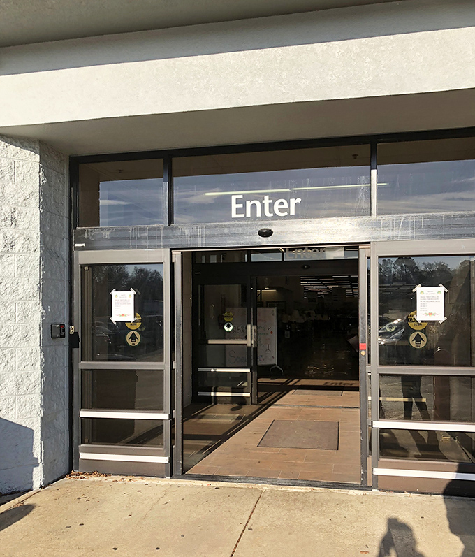 "Enter" promises the sign, but what it doesn't tell you is that you might emerge hours later with unexpected treasures and significantly less trunk space.