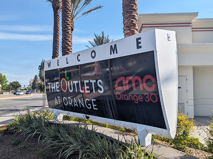 The welcoming sign promises not just shopping but an experience&mdash;AMC theaters for when your credit card needs a timeout.