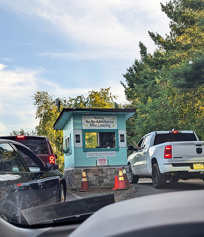 That iconic teal ticket booth&mdash;the gateway to your evening's adventure&mdash;stands like a cheerful sentinel between ordinary life and movie magic.