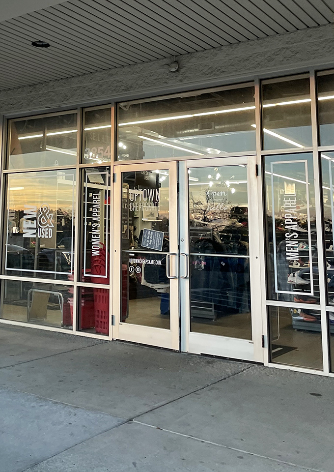 Glass doors that might as well be portals to a parallel universe where designer labels don't require a second mortgage.