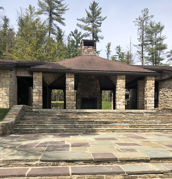 This CCC-era stone pavilion isn't just historic—it's where countless family memories have been made around crackling fires for generations.