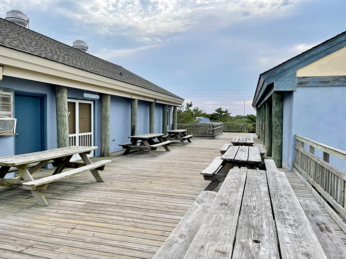 This weathered deck has witnessed countless sunrises, family picnics, and "I forgot the sunscreen" moments. Beach headquarters for the perfectly unpretentious.