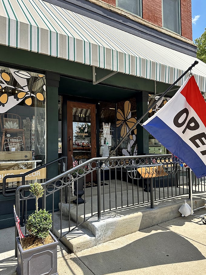 That "OPEN" flag might as well say "ADVENTURE AWAITS" &ndash; the wrought iron railing a perfect prelude to vintage discoveries.