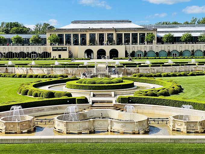 Architectural elegance meets horticultural brilliance in this view that makes you wonder if you've stumbled into a royal European estate rather than Pennsylvania.