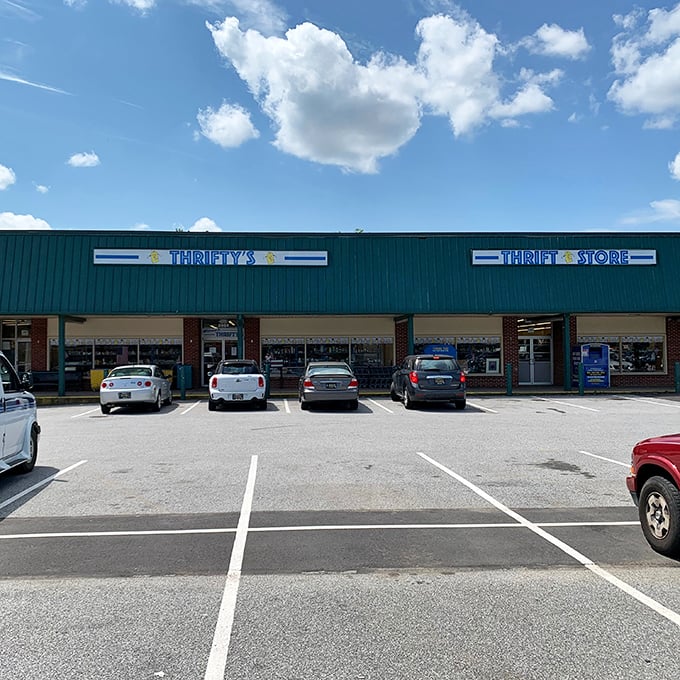 Thrifty's sign glows against the Delaware sky like a beacon for the budget-conscious. Your wallet is already breathing a sigh of relief.