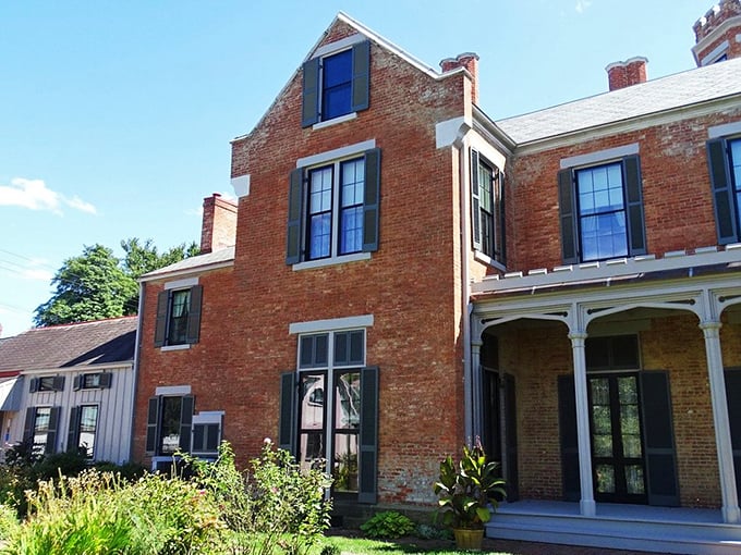 Sunlight plays across the brick exterior, highlighting the architectural details that make you wonder if you've accidentally stumbled into a Jane Austen novel.