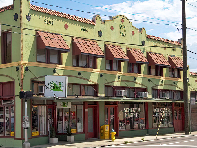 Sunshine bounces off this mint-green vintage marketplace like it's 1965 all over again. The building itself is as much a collectible as anything inside.