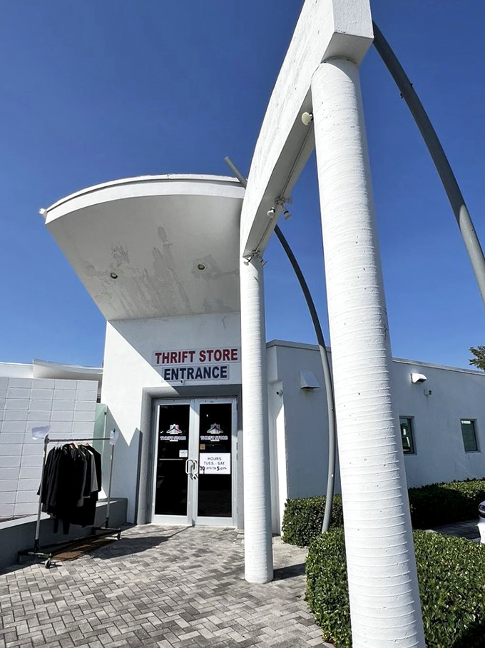 Palm trees frame this thrifter's oasis, where the bright Florida sunshine seems to highlight the building as if saying, "Treasures inside!"