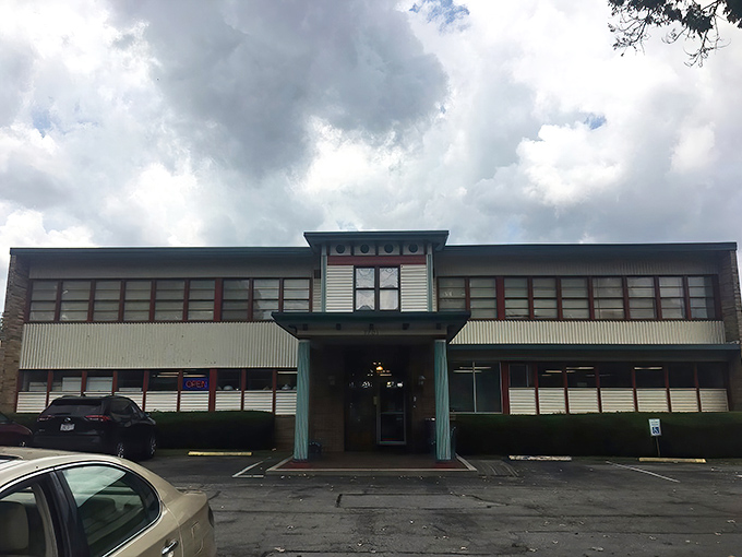 The entrance beckons with all the subtlety of a siren song. That green bench isn't for resting&mdash;it's for contemplating how many treasures will fit in your trunk.
