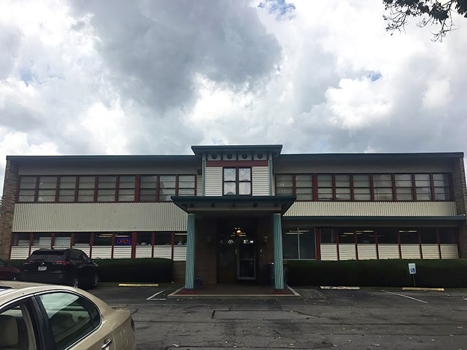 The entrance beckons with all the subtlety of a siren song. That green bench isn't for resting&mdash;it's for contemplating how many treasures will fit in your trunk.