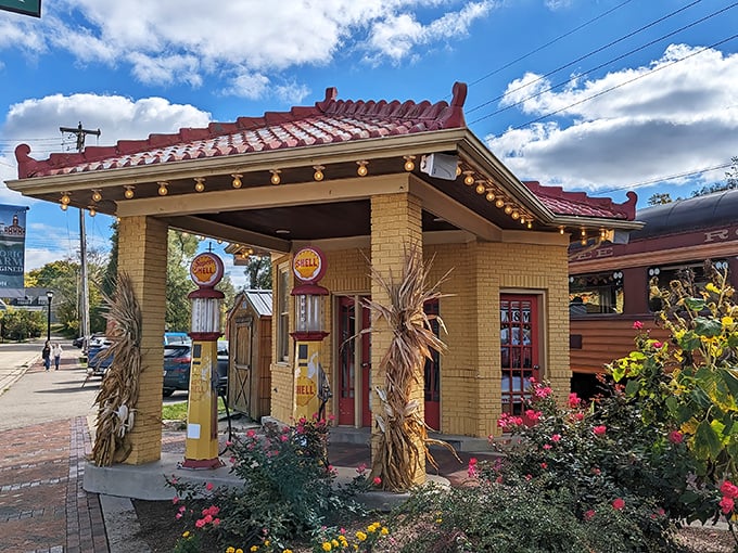 This vintage Shell station stands as a colorful sentinel near the railroad, its retro charm and vibrant flower beds offering a perfect photo opportunity for nostalgic travelers.