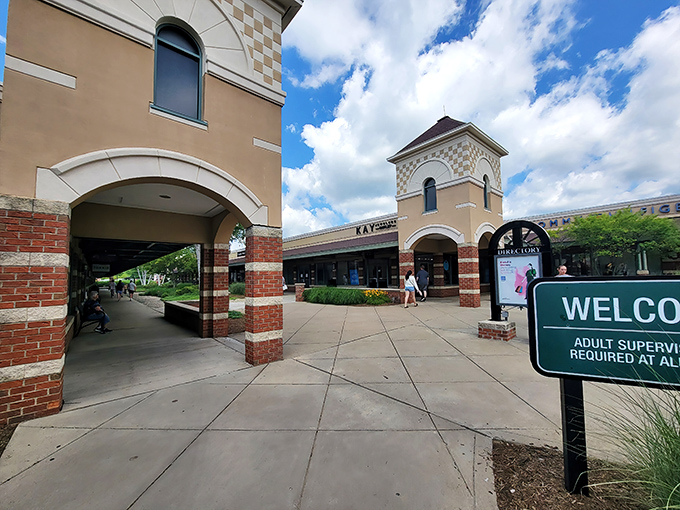 Architectural details that say "quaint village square" while your credit card whispers "metropolitan shopping spree."