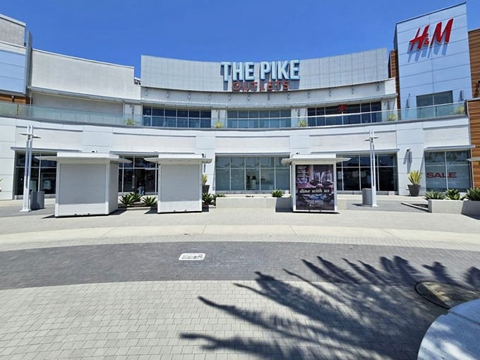 The modern architecture beckons bargain hunters with promises of retail treasures waiting inside these stylish walls.