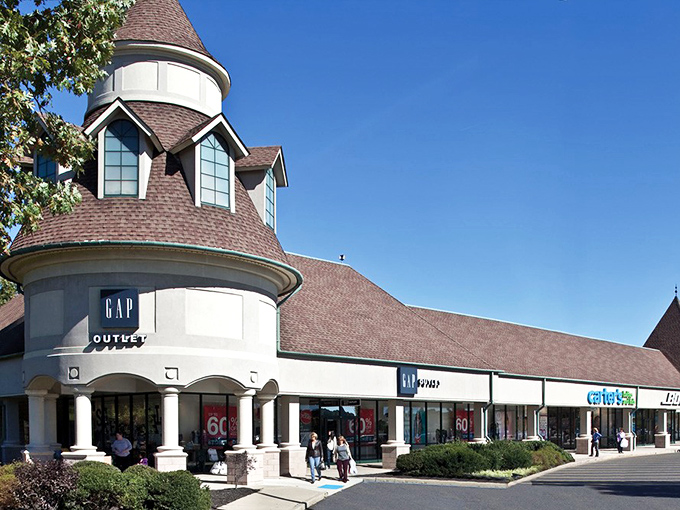 Gap Outlet anchors its corner with that iconic tower, promising wardrobe staples at prices that won't make your credit card weep.