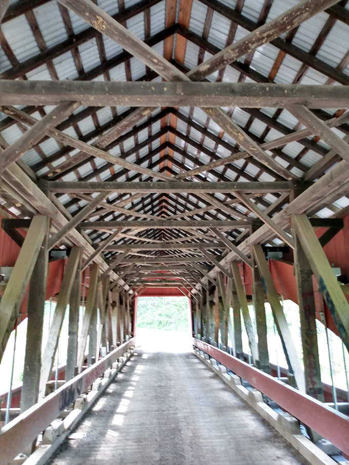 Engineering poetry in wooden beams. The interior reveals a geometric masterpiece that's been sheltering travelers since Lincoln was president.