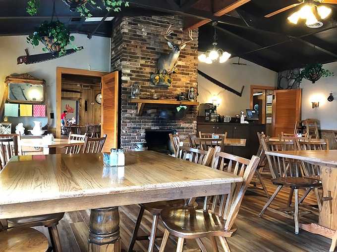 Where rustic meets delicious: The stone fireplace and wooden tables create the perfect backdrop for Tennessee comfort food magic.