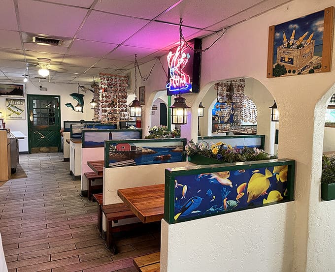 Nautical charm meets no-nonsense dining. The glowing lobster sign serves as a lighthouse, guiding hungry desert dwellers to their seafood salvation.