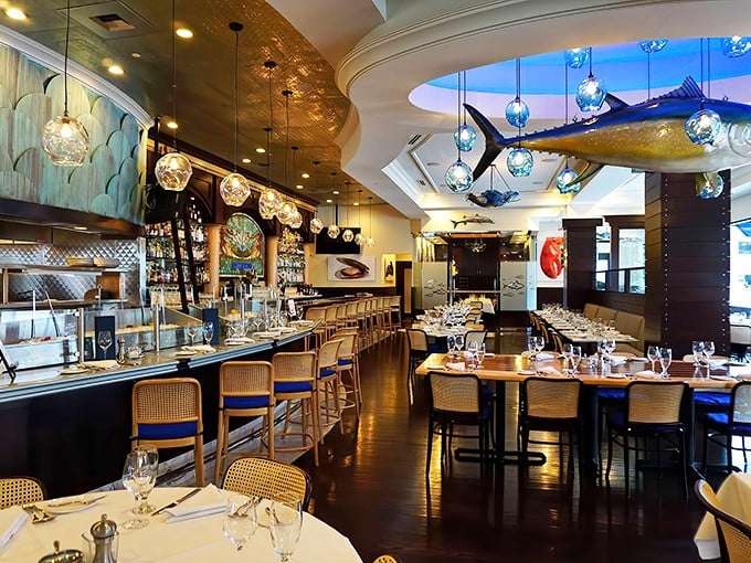 Suspended glass orbs and a magnificent yellowfin tuna create an underwater dreamscape where diners feast beneath the watchful eye of the catch-of-the-day's more fortunate cousin.