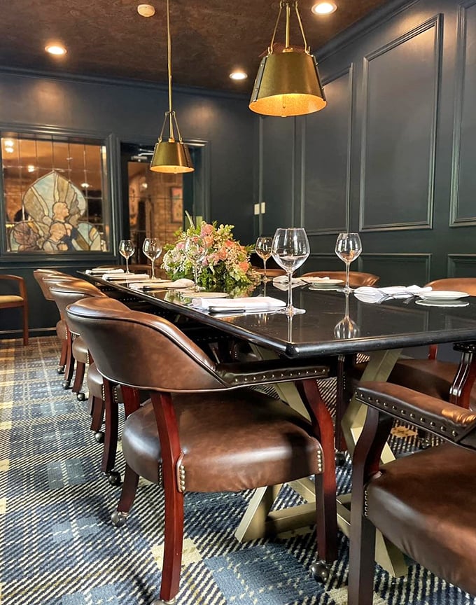 Blue walls, brass lighting, and leather chairs create the kind of dining room where memories are made and diets are gloriously forgotten.