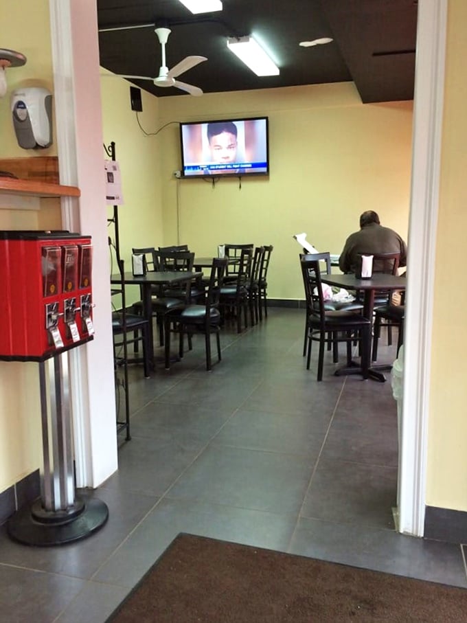 Simple yellow walls and black tables create the perfect backdrop for the star of the show&mdash;that legendary pan pizza.