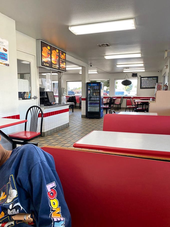 Classic red vinyl booths and checkerboard floors create the quintessential diner experience&mdash;where conversations flow as freely as the fountain drinks.