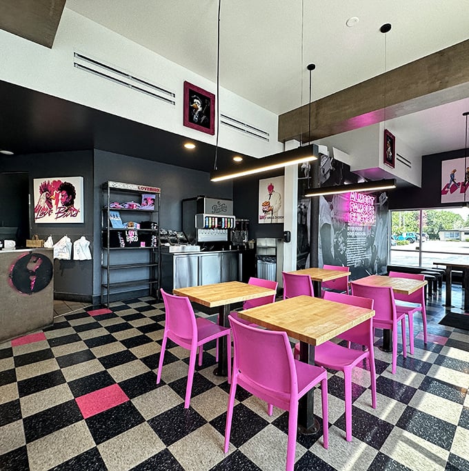 Inside, hot pink chairs and checkerboard floors create a space where Elvis would feel at home ordering extra crispy.
