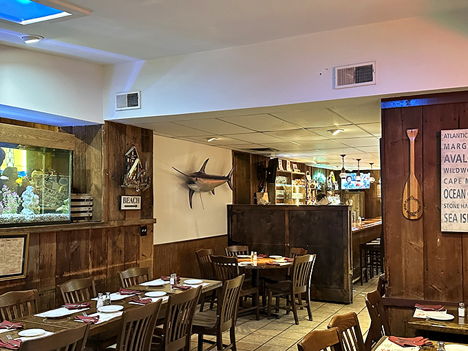 Inside, nautical charm abounds with wood-paneled walls, mounted fish, and an aquarium&mdash;like stepping into a cozy New England fishing village.
