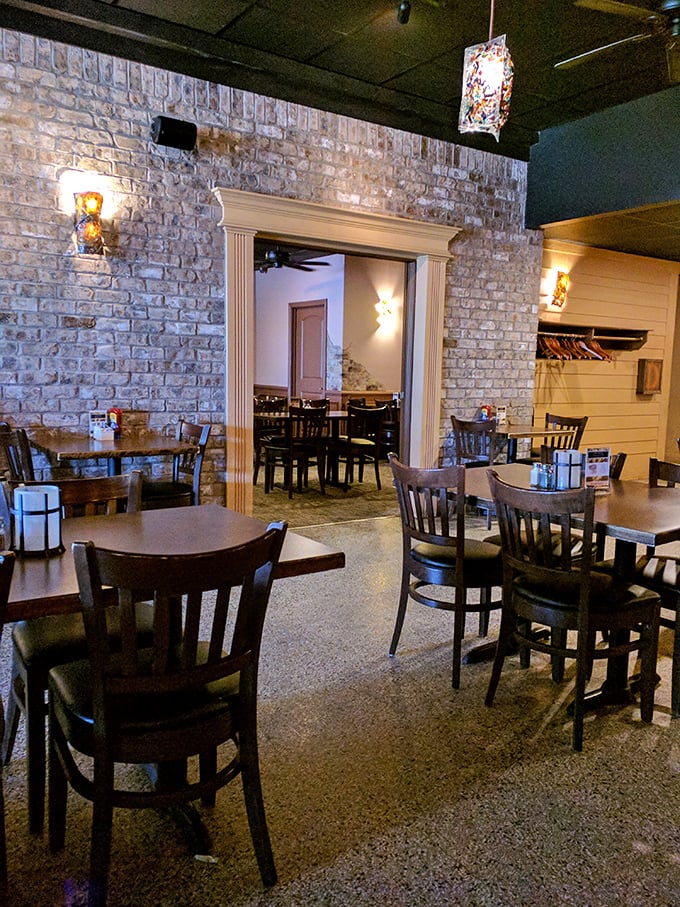 Exposed brick walls tell stories while you dine. This isn't just restaurant decor—it's architectural foreplay for the meal to come.