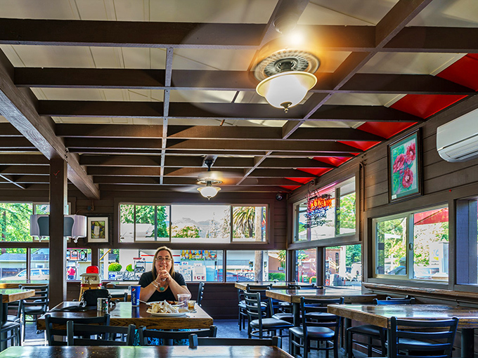 Wooden beams, ceiling fans, and natural light create the perfect backdrop for the serious business of barbecue consumption &ndash; no white tablecloths needed here.