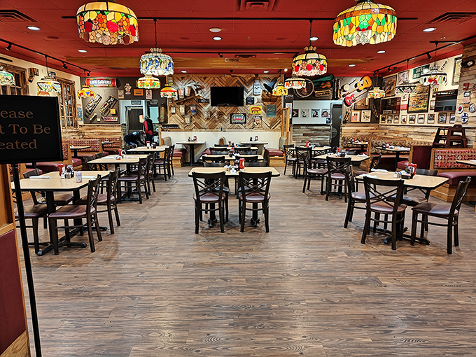 Tiffany-style lamps cast a warm glow over wooden tables where breakfast dreams come true. It's like dining inside a cozy jewelry box.