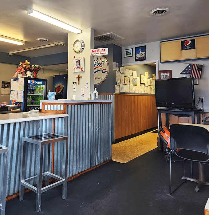 Inside, corrugated metal meets wood paneling in a no-nonsense interior where the focus is squarely on the food, not fancy design magazines.