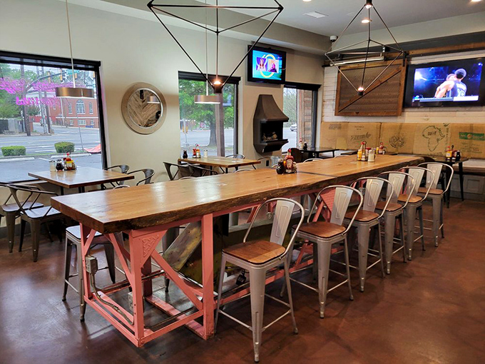 Industrial-chic meets Southern comfort in Rosie's dining area. That communal table isn't just furniture—it's an invitation to make friends over fantastic food.