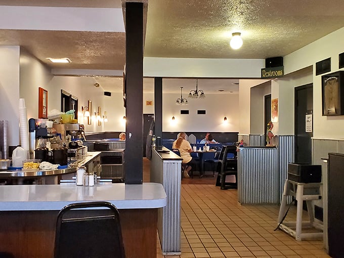 Classic diner interior where conversations flow as freely as the coffee. No designer needed when authenticity is your best decoration.