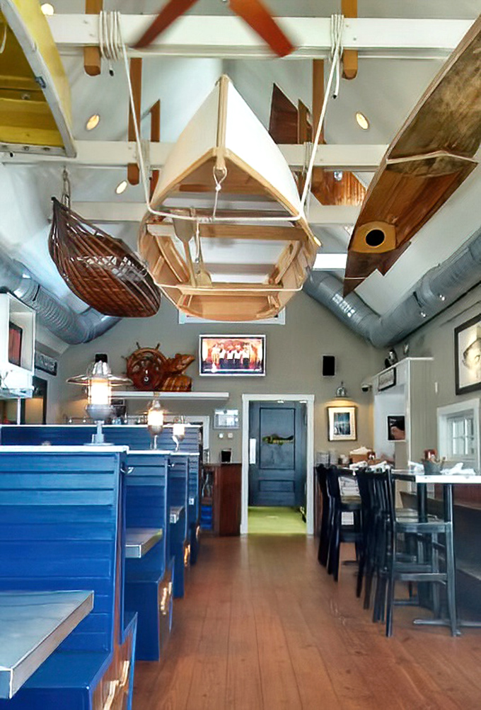 Suspended boats and nautical treasures transform the dining room into a seafarer's dream. Who needs a yacht when you can dine under one?