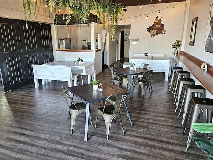 Modern rustic meets meat sanctuary. The hanging plants add a touch of life, though they're vastly outnumbered by the plants that have been sacrificed to the BBQ gods.