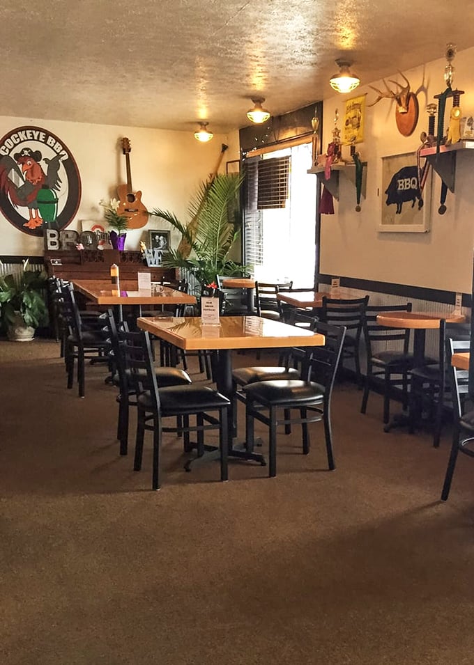 Rustic charm meets barbecue authenticity inside Cockeye BBQ. That rooster logo isn't just watching you eat—it's judging how many napkins you'll need.