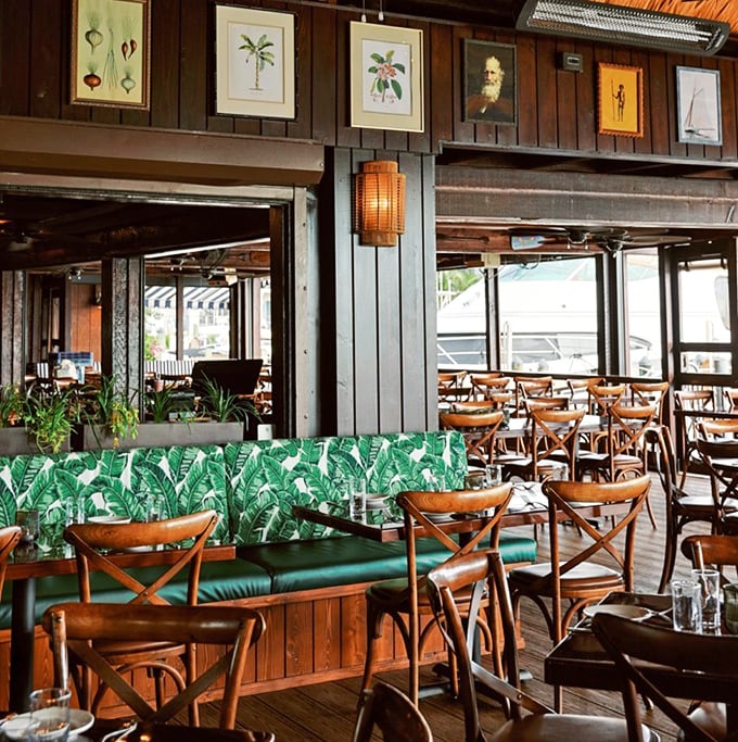 Old Florida meets tropical chic inside, where banana leaf upholstery and weathered wood create the perfect backdrop for seafood indulgence.